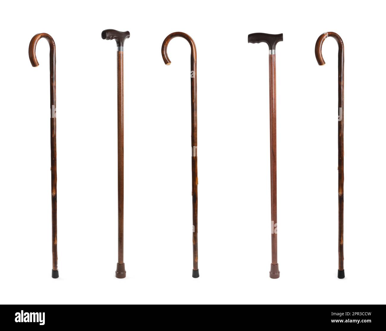 Set with elegant wooden walking canes on white background Stock Photo ...