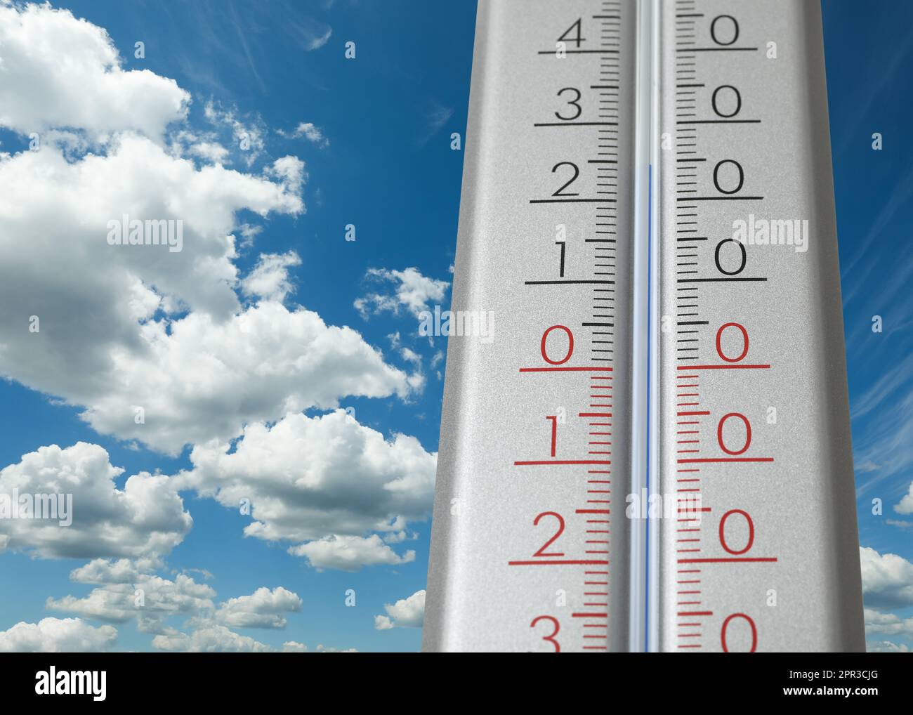 Weather thermometer and beautiful sky with fluffy clouds on background ...