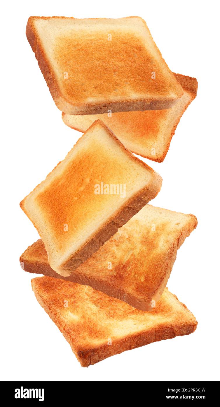 Delicious toasted bread flying on white background Stock Photo - Alamy