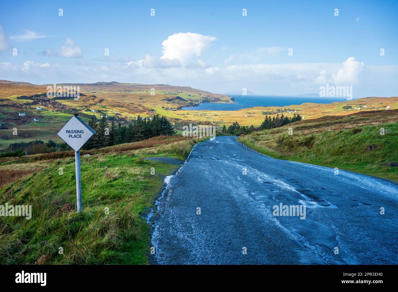 Single-track road with passing places winding through the dramatic ...
