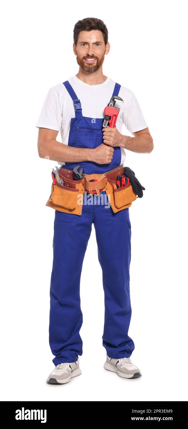 Professional plumber with pipe wrench and tool belt on white background ...