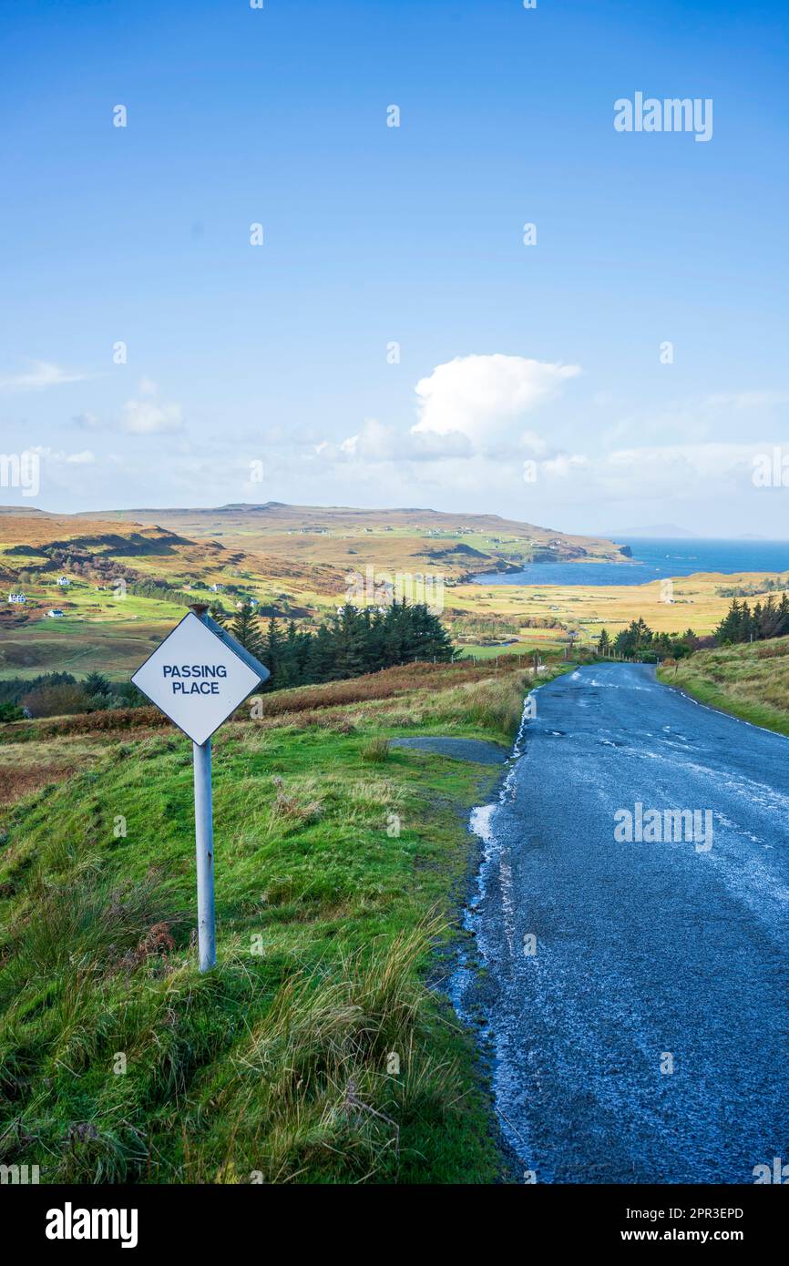 Single-track road with passing places winding through the dramatic ...