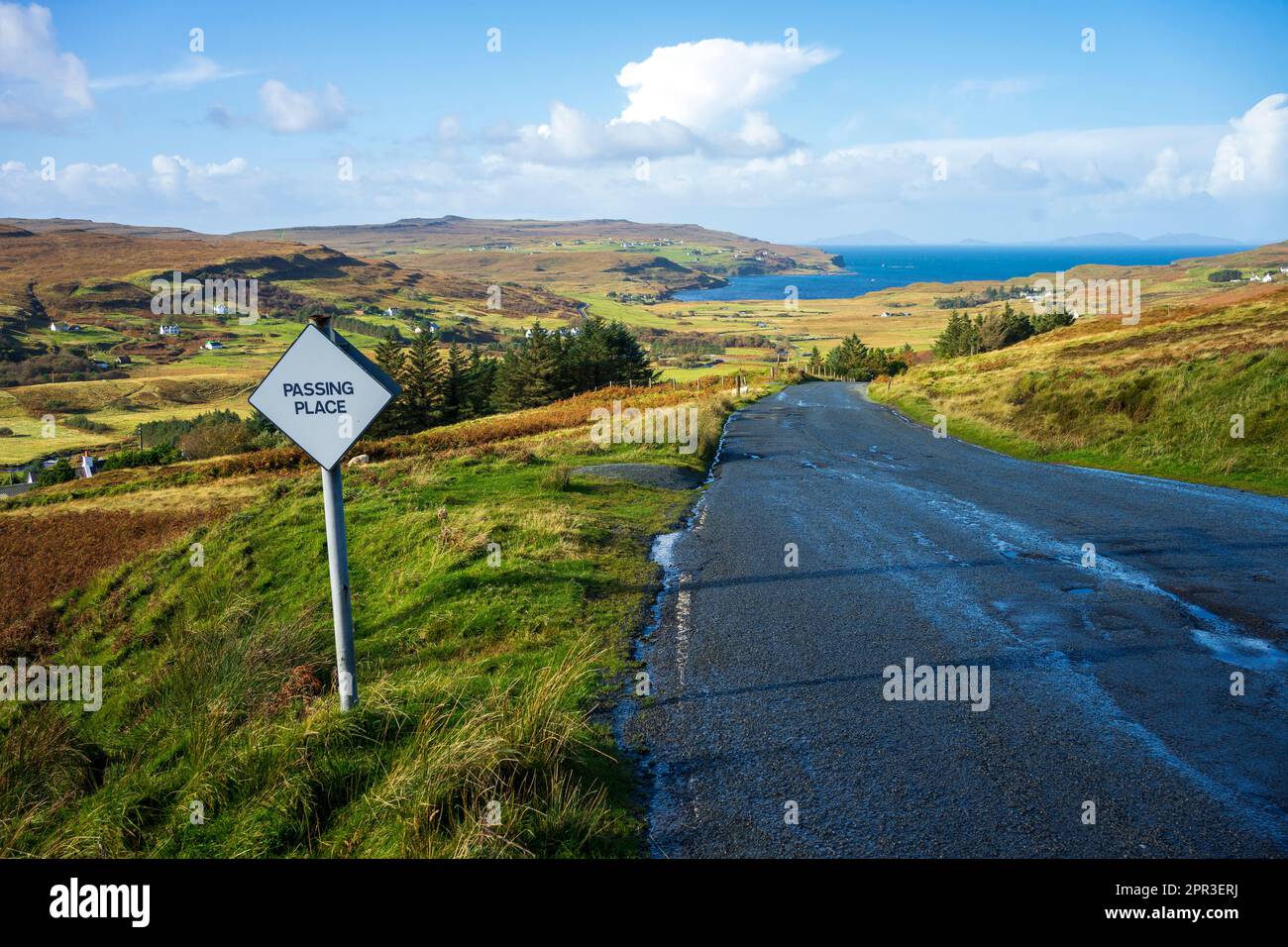 Single-track road with passing places winding through the dramatic ...