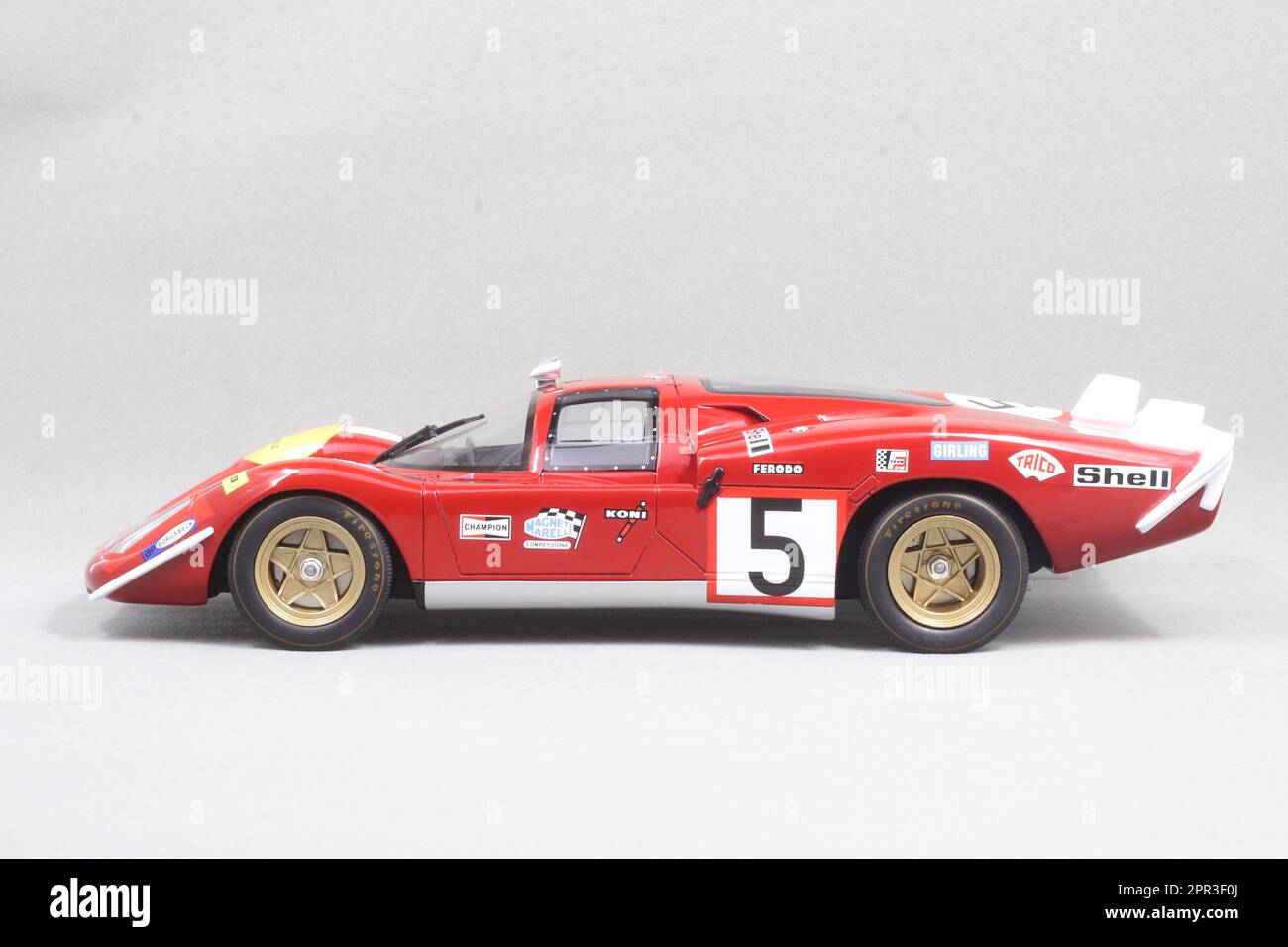 a red race car with white numbers and a number on it and toy Stock ...