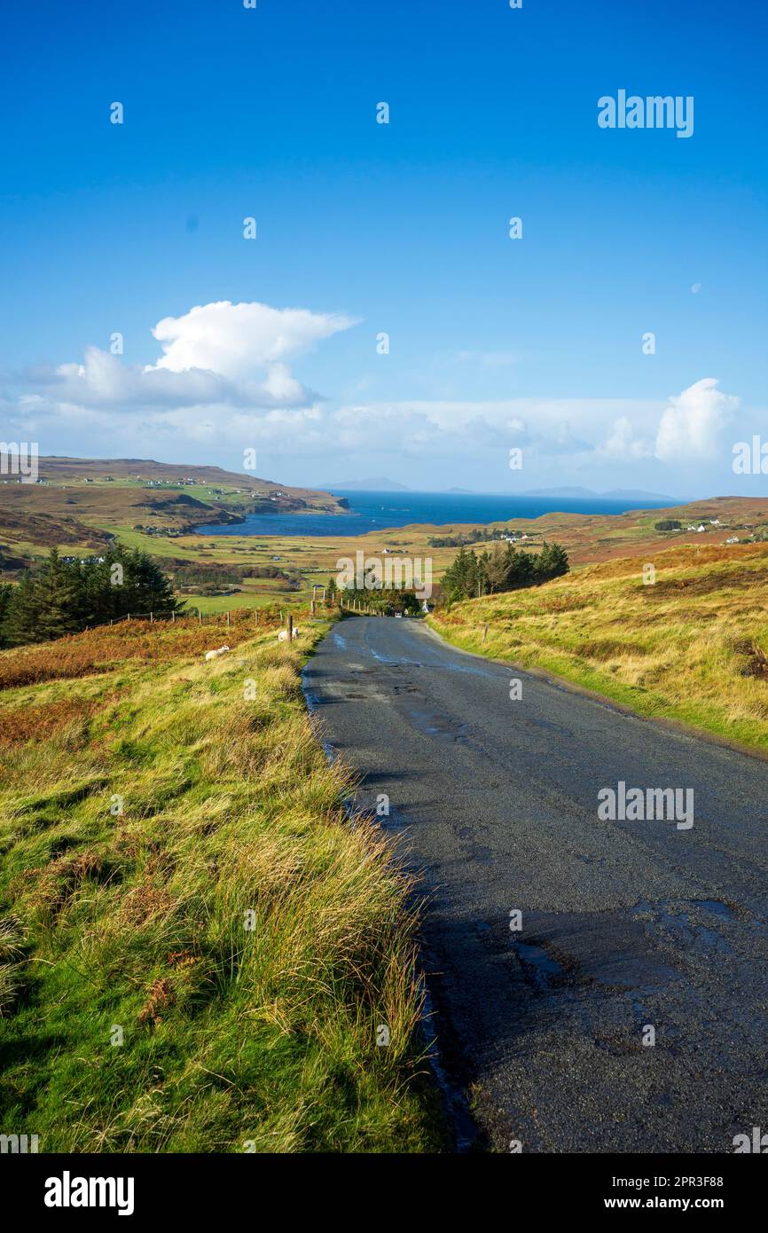 Single-track road with passing places winding through the dramatic ...