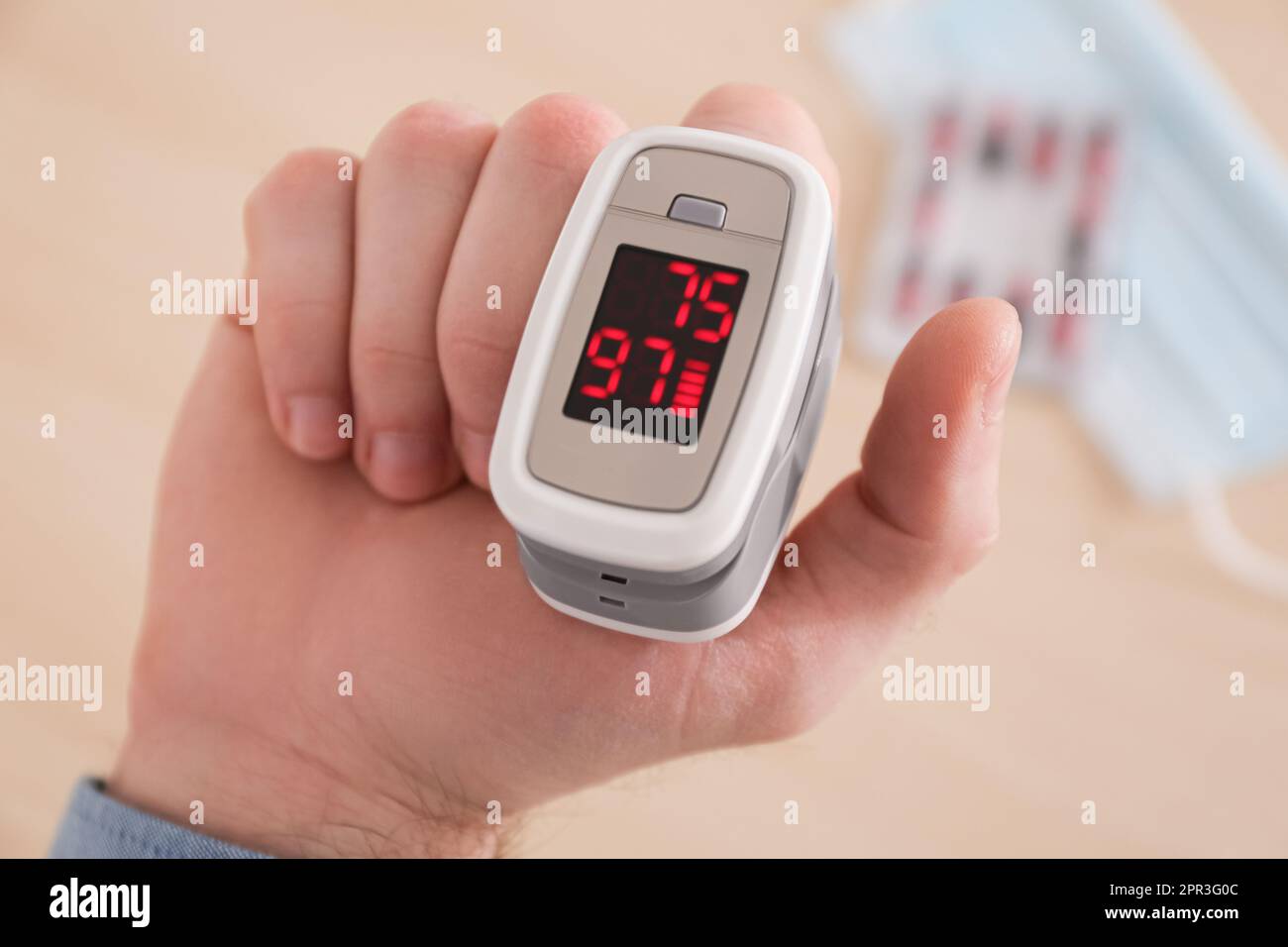 Man measuring oxygen level with modern fingertip pulse oximeter on ...