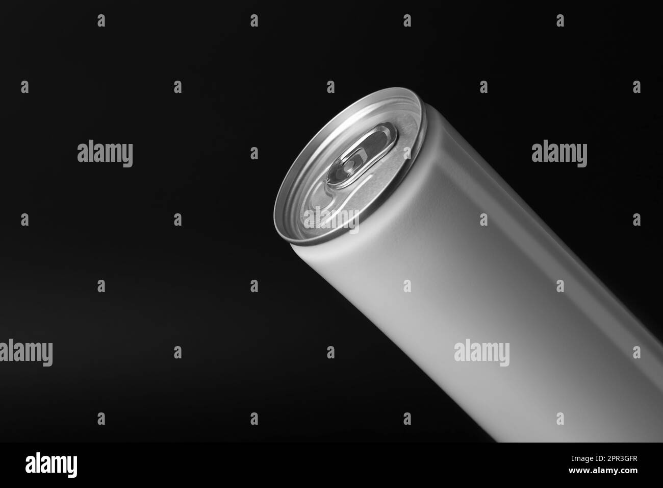 White can of energy drink on black background, closeup. Space for text ...