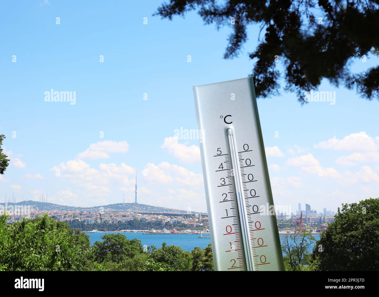 Weather thermometer and view of beautiful city and sea on background ...