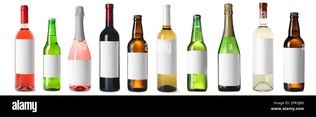 Set with bottles of different alcohol drinks on white background ...