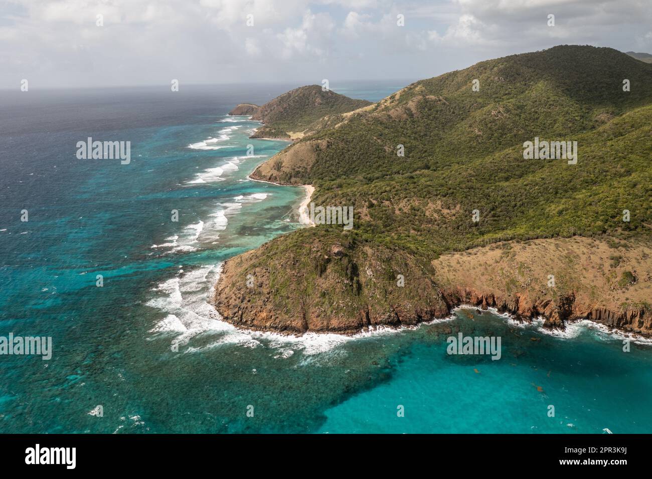 Aerial view of the tranquil blue waters of Rendezvous Beach in Antigua ...