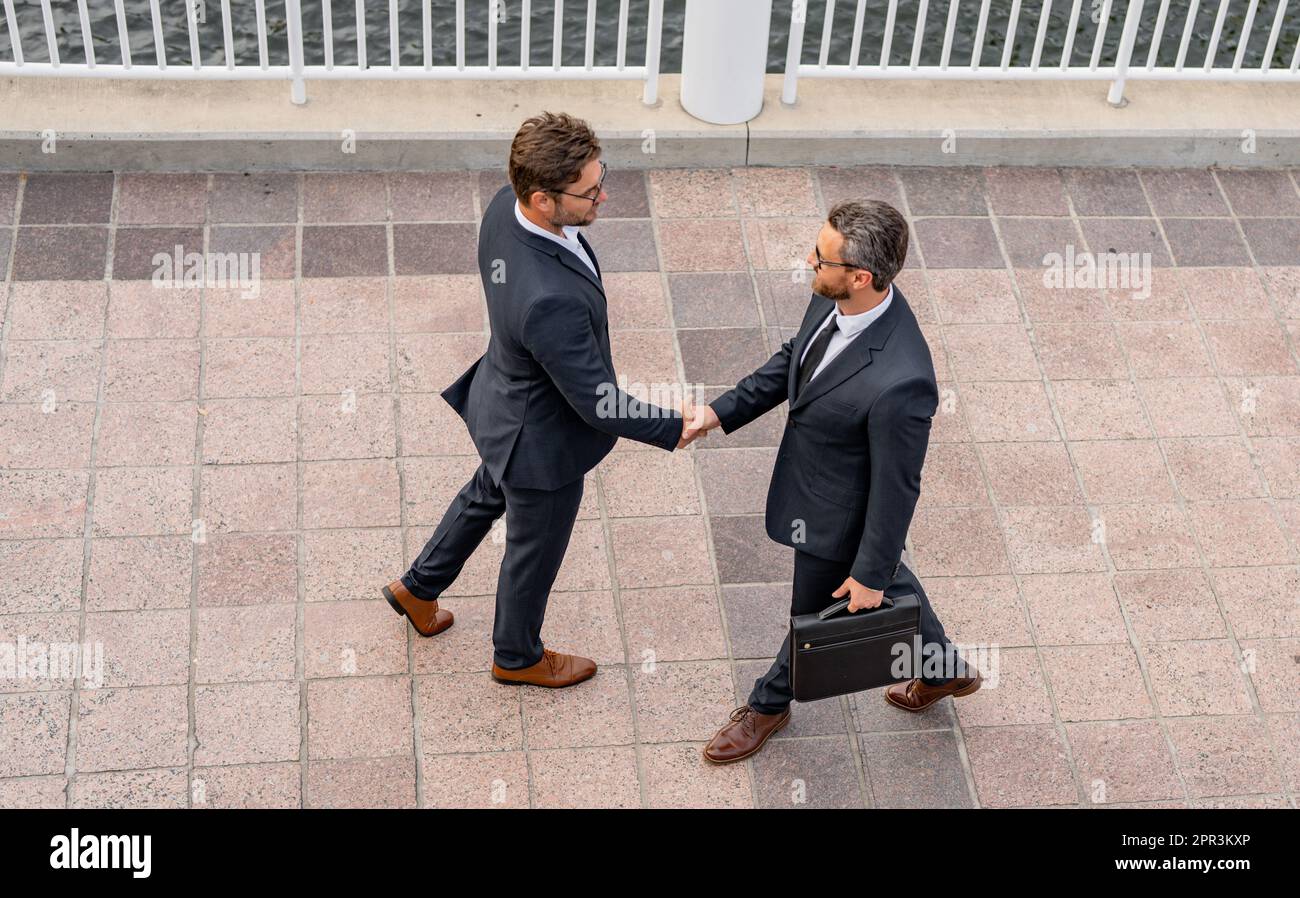 Successful teamwork. Business people shaking hands. Businessmen in suit ...
