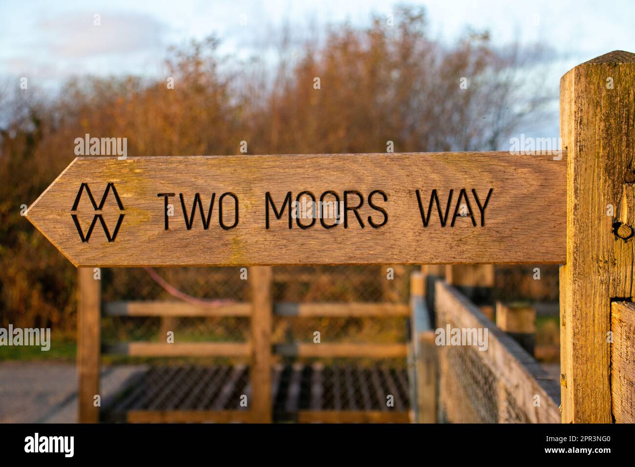 wooden TWO MOORS WAY sign post with cattle grid in the background Stock ...