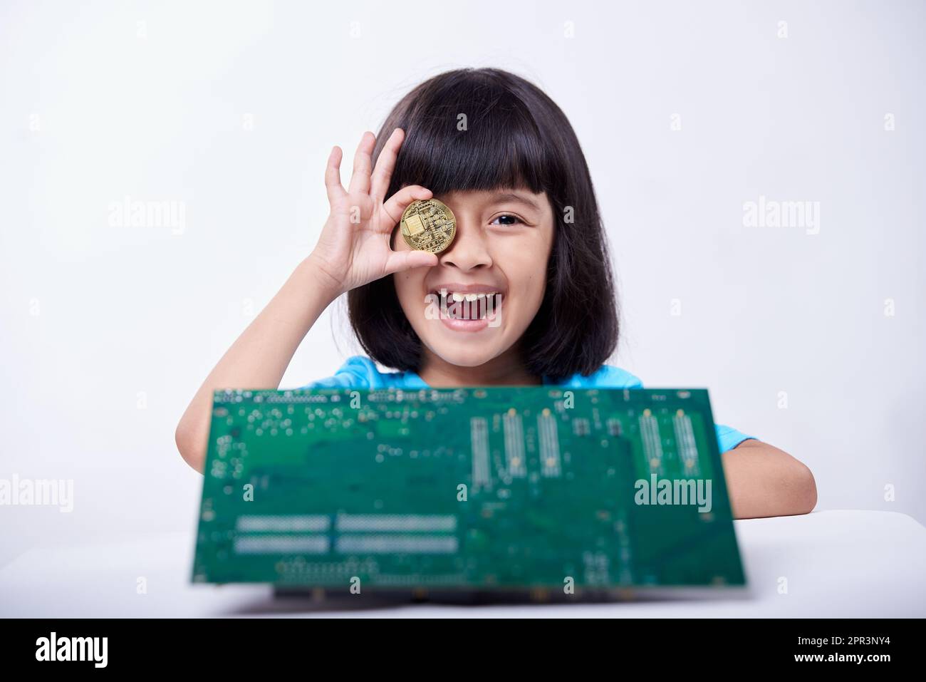 Little girl playing and learning with Cryptocurrency coins Stock Photo ...