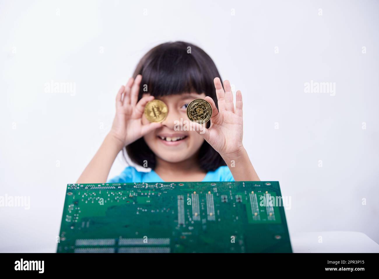 Little girl playing and learning with Cryptocurrency coins Stock Photo ...