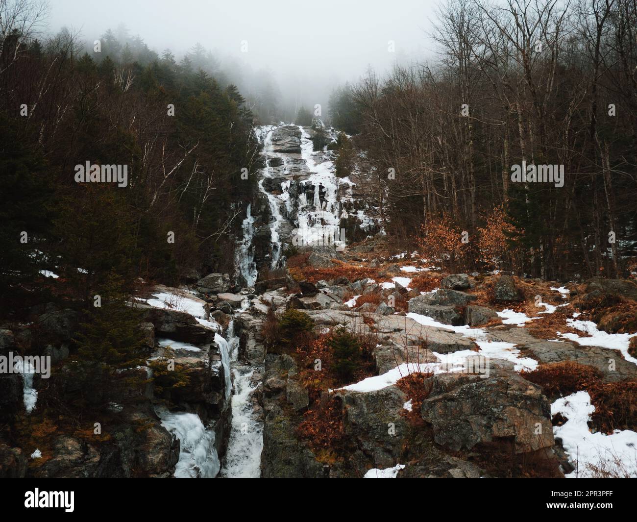 A picturesque landscape featuring a majestic waterfall cascading ...
