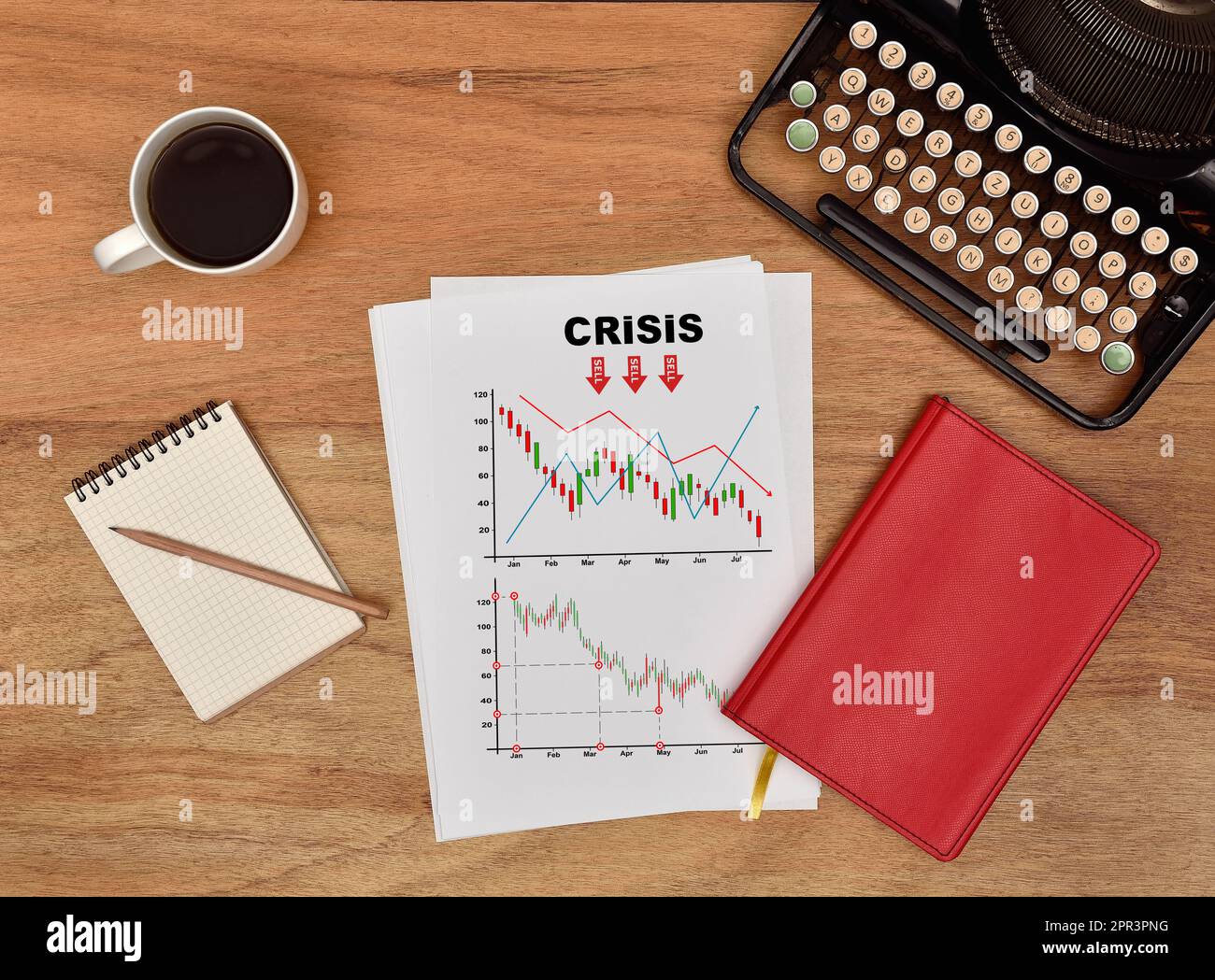 crisis chart on a white sheet of paper. typewriter, diary and cup of ...