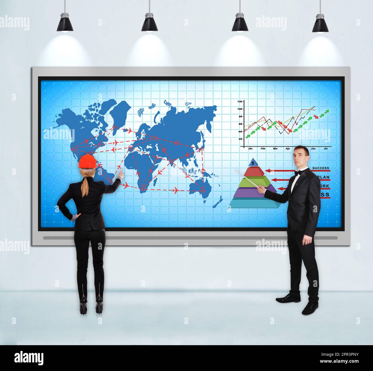 Coworker pointing to tv screen with start up concept Stock Photo - Alamy