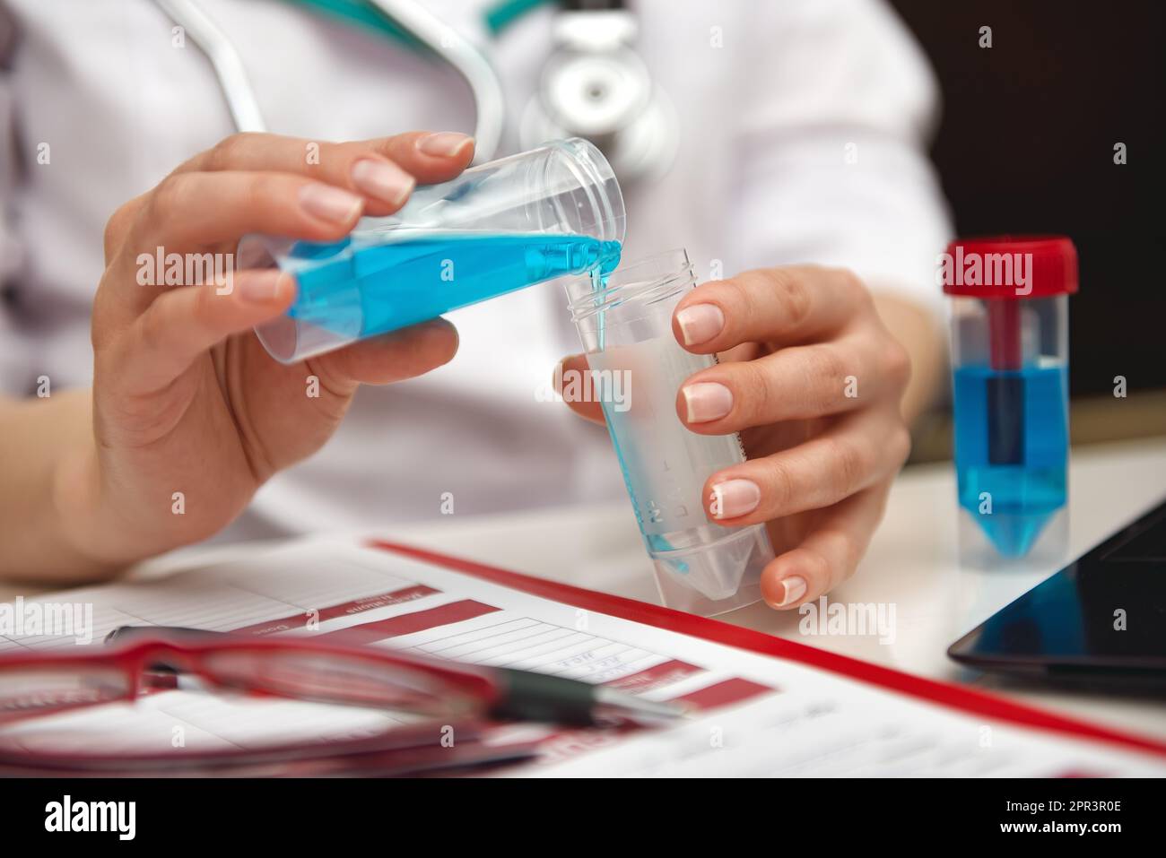 Scientist mixing chemicals hi-res stock photography and images - Alamy