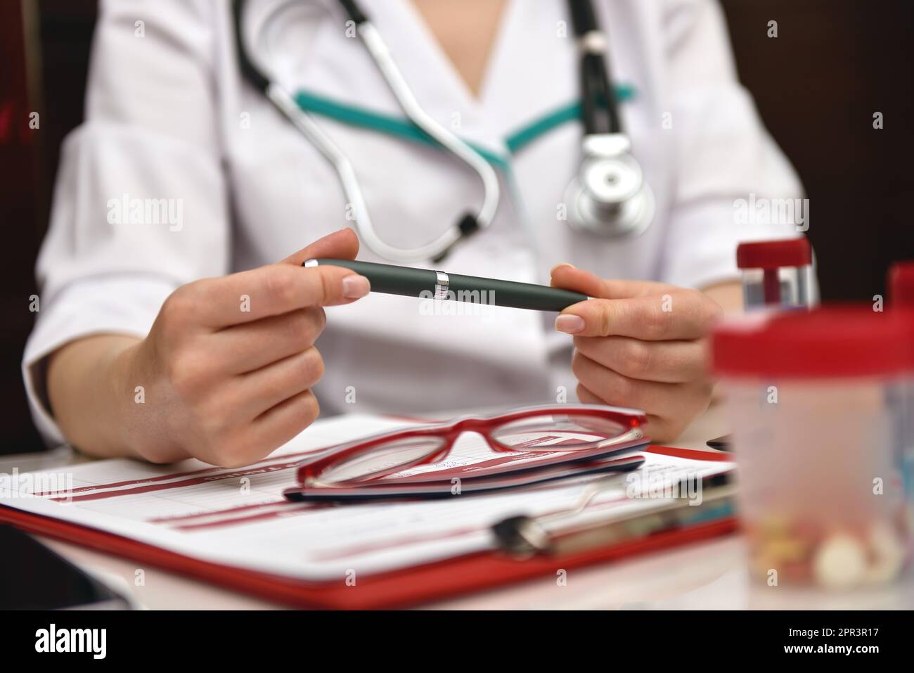Doctor holding pen patient hi-res stock photography and images - Alamy