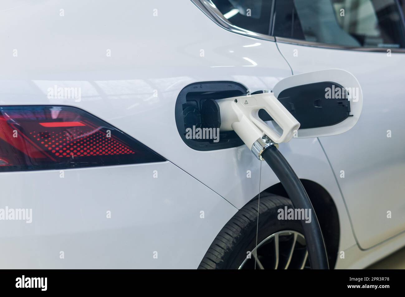 charging station cable connector in the inlet port of a modern ...