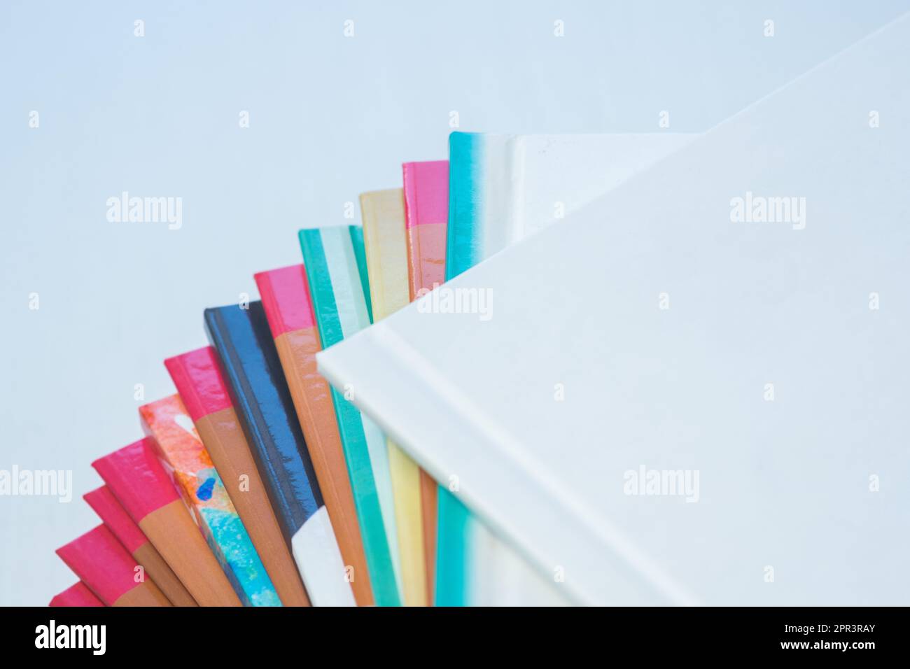multi-colored spines of photo books close-up, partial blur Stock Photo ...