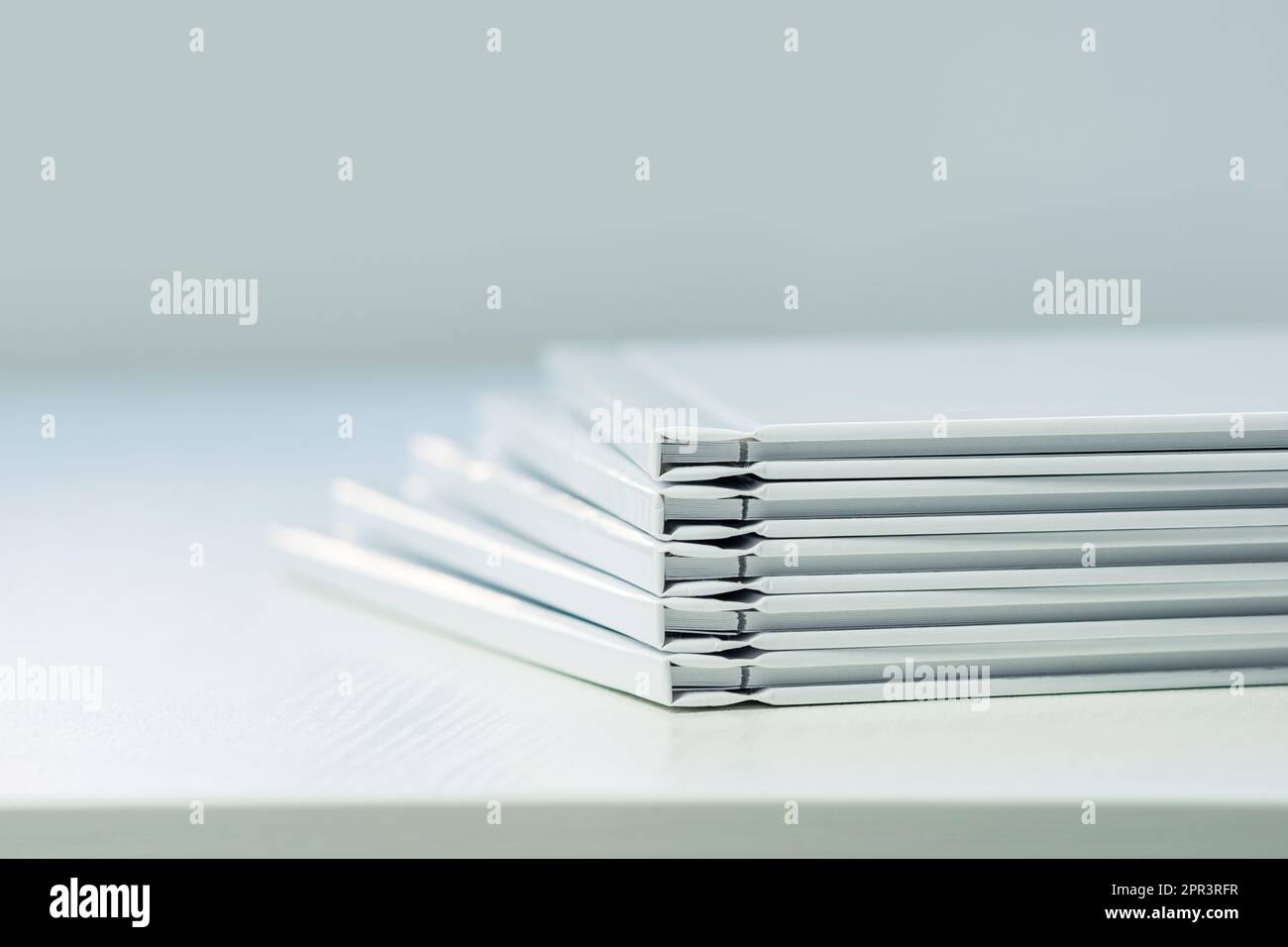 covers of photo books with clean empty white covers, close-up, partial ...