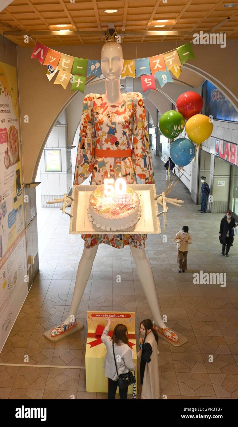 Nana-chan, a fashionable giant mannequin stands in front of the ...