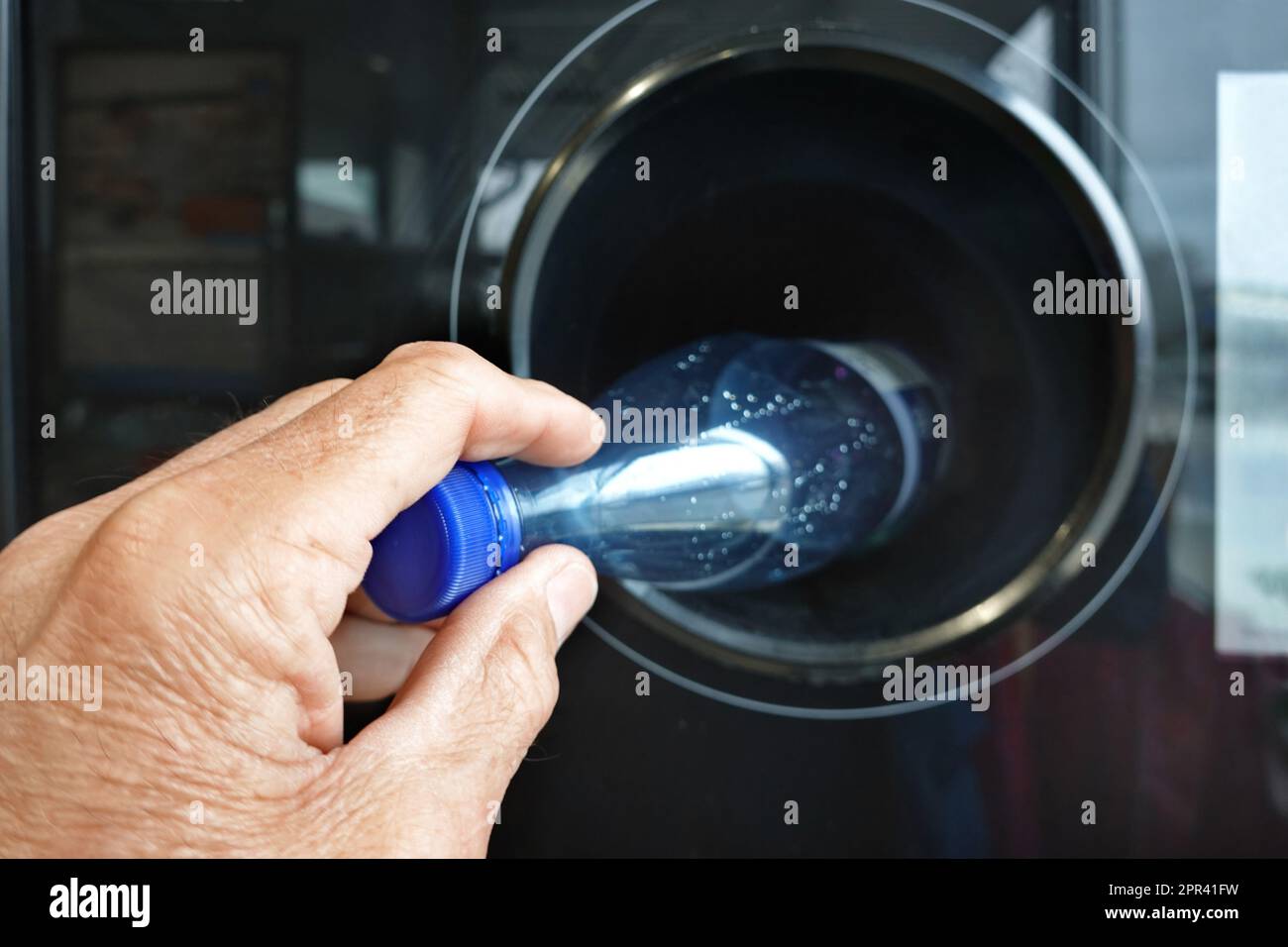 PET bottle is thrown into a reverse vending machine, Germany Stock ...