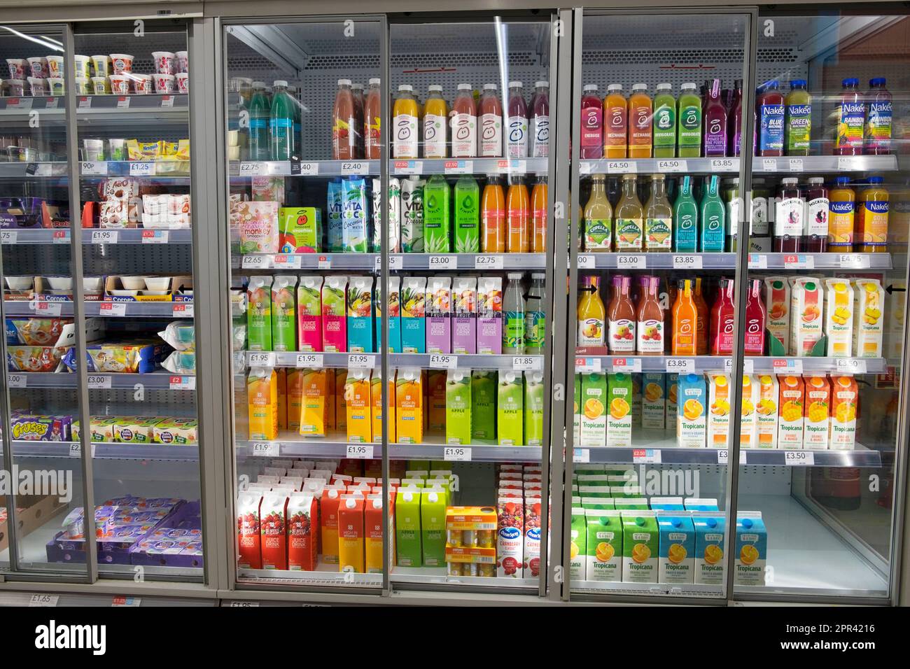 Cold drinks refrigeration cabinet display of juice fruit juices in Co ...