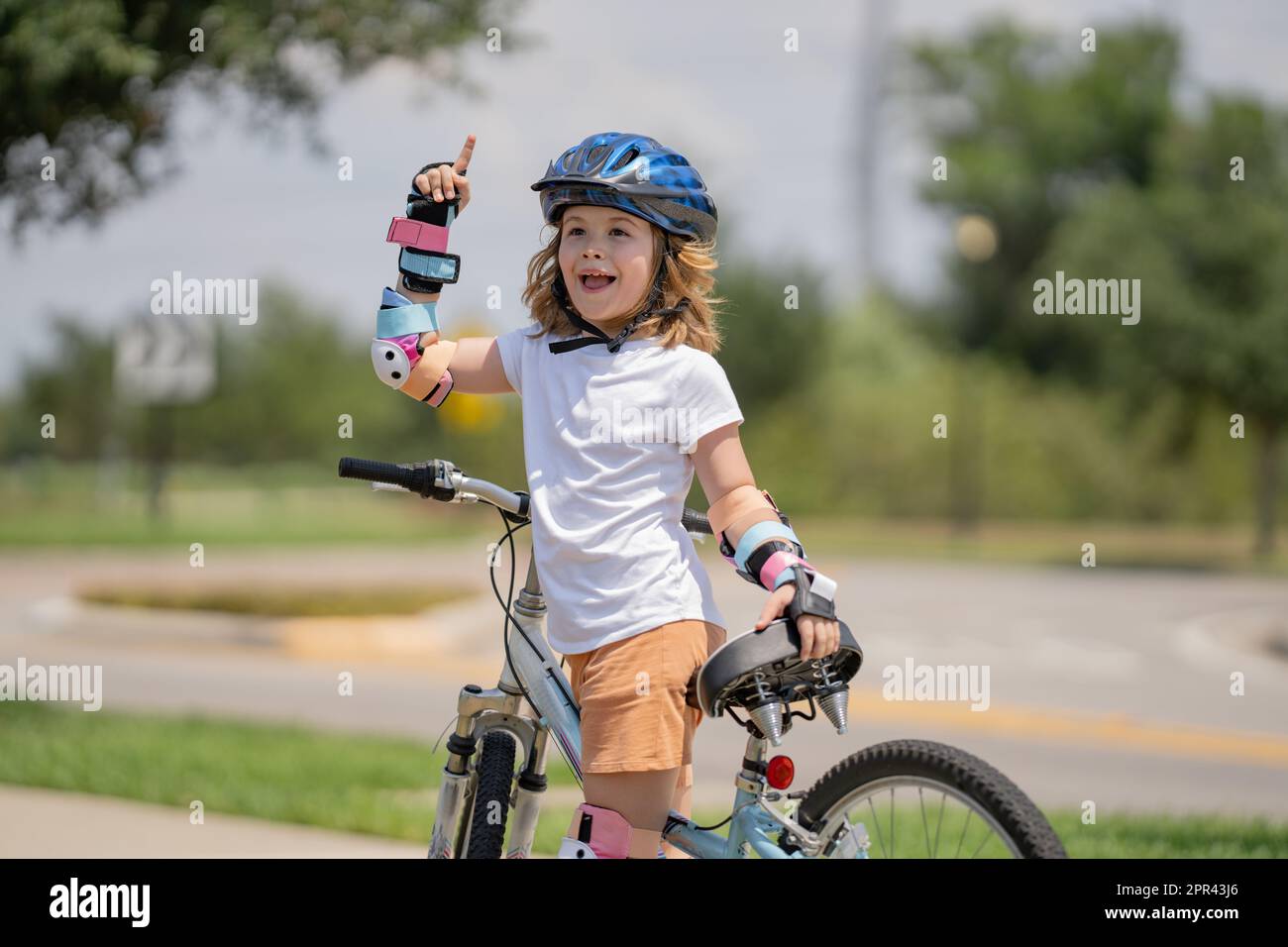 Kid learning to ride bike. Child riding bicycle. Little kid boy in ...