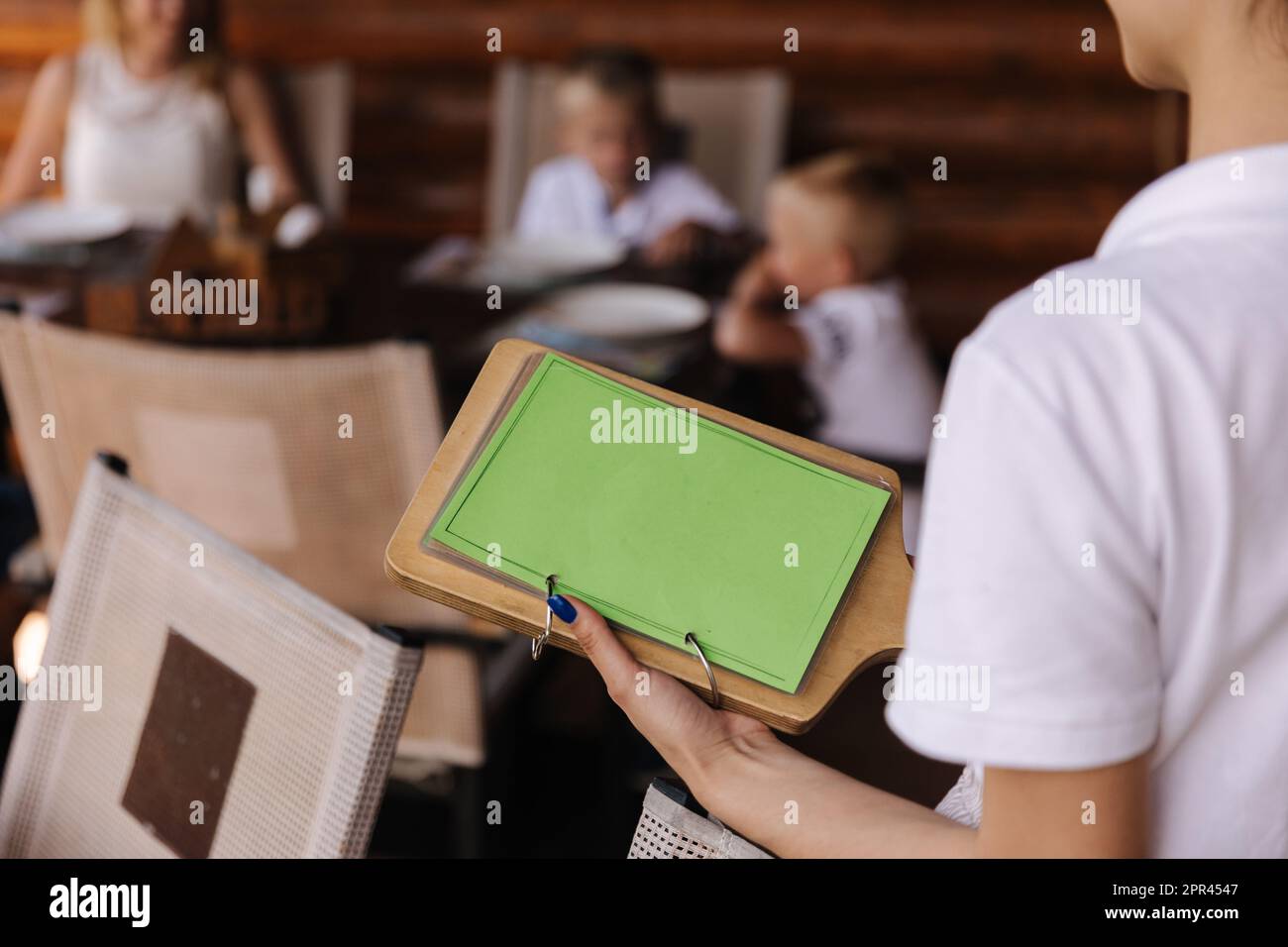 Middle selection of waitress hold menu and bring it to customers ...