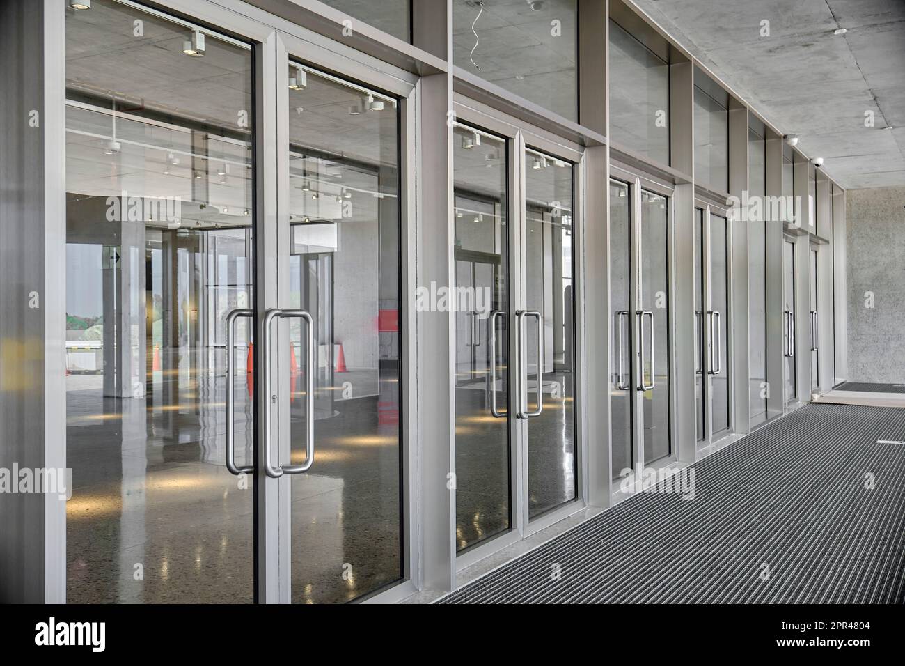 Revolving doors. The facade of a modern shopping center or station, an ...