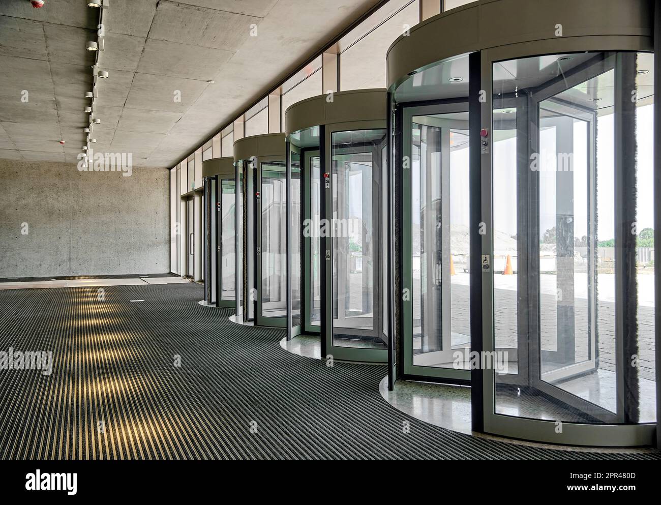 Revolving doors. The facade of a modern shopping center or station, an ...