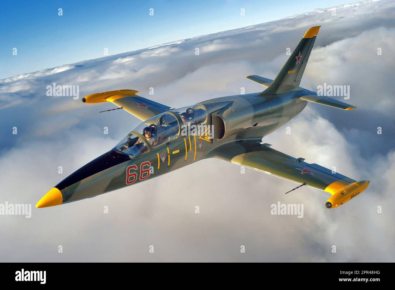 An air-to-air portrait of an Aero L-39 Albatros jet above the clouds ...