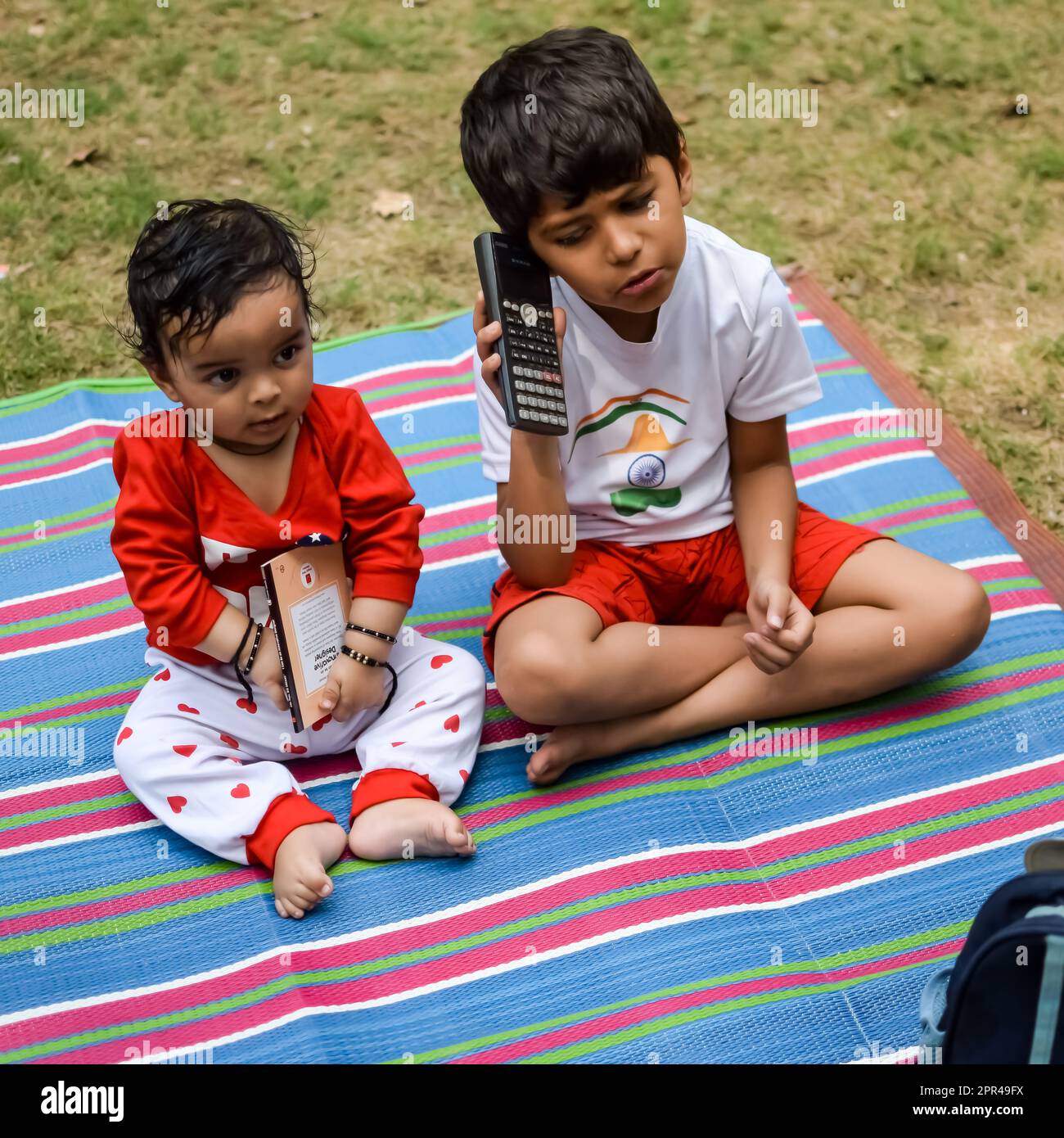 Two happy boys in society park, happy Asian brothers who are smiling ...