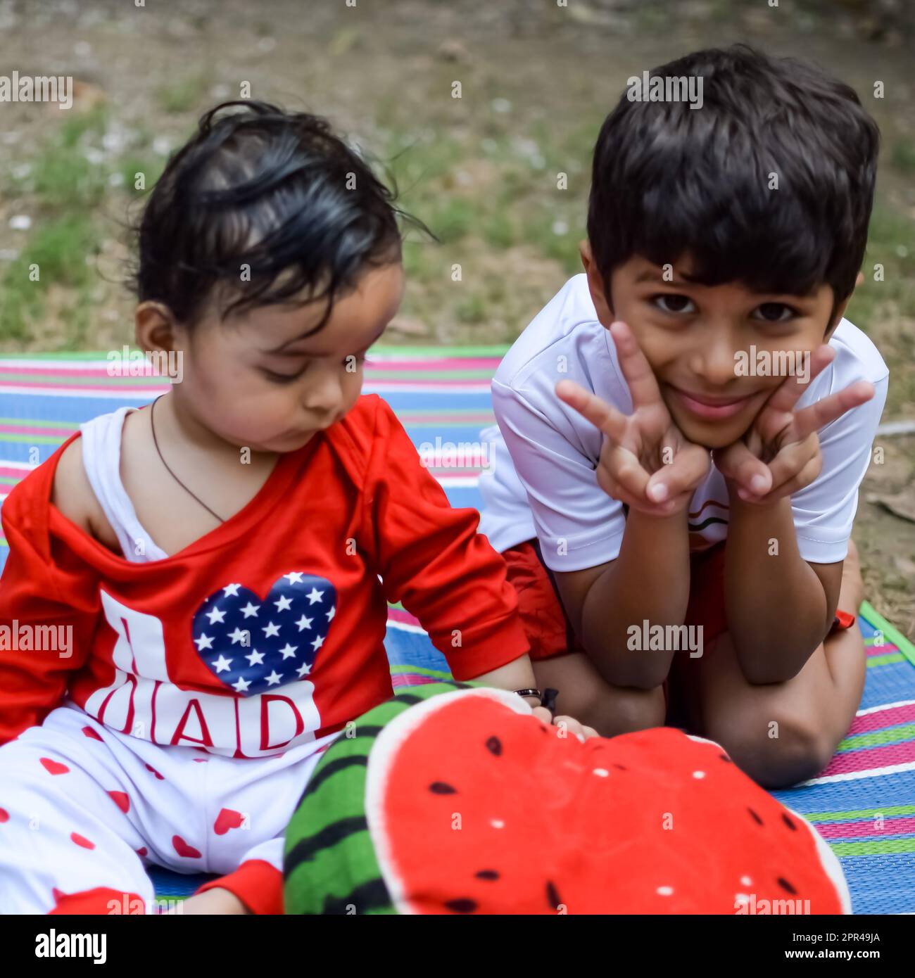 Two happy boys in society park, happy Asian brothers who are smiling ...