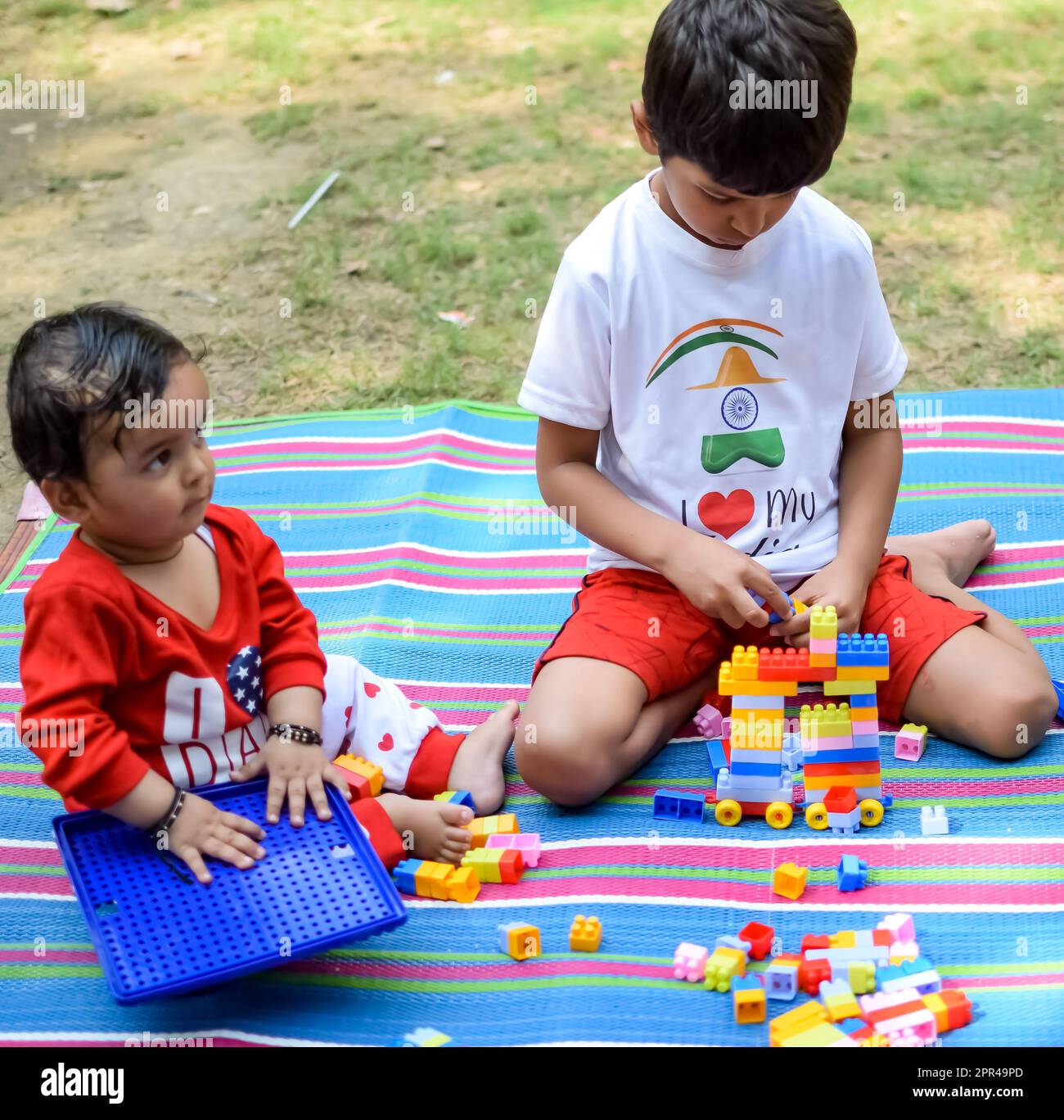 Two happy boys in society park, happy Asian brothers who are smiling ...