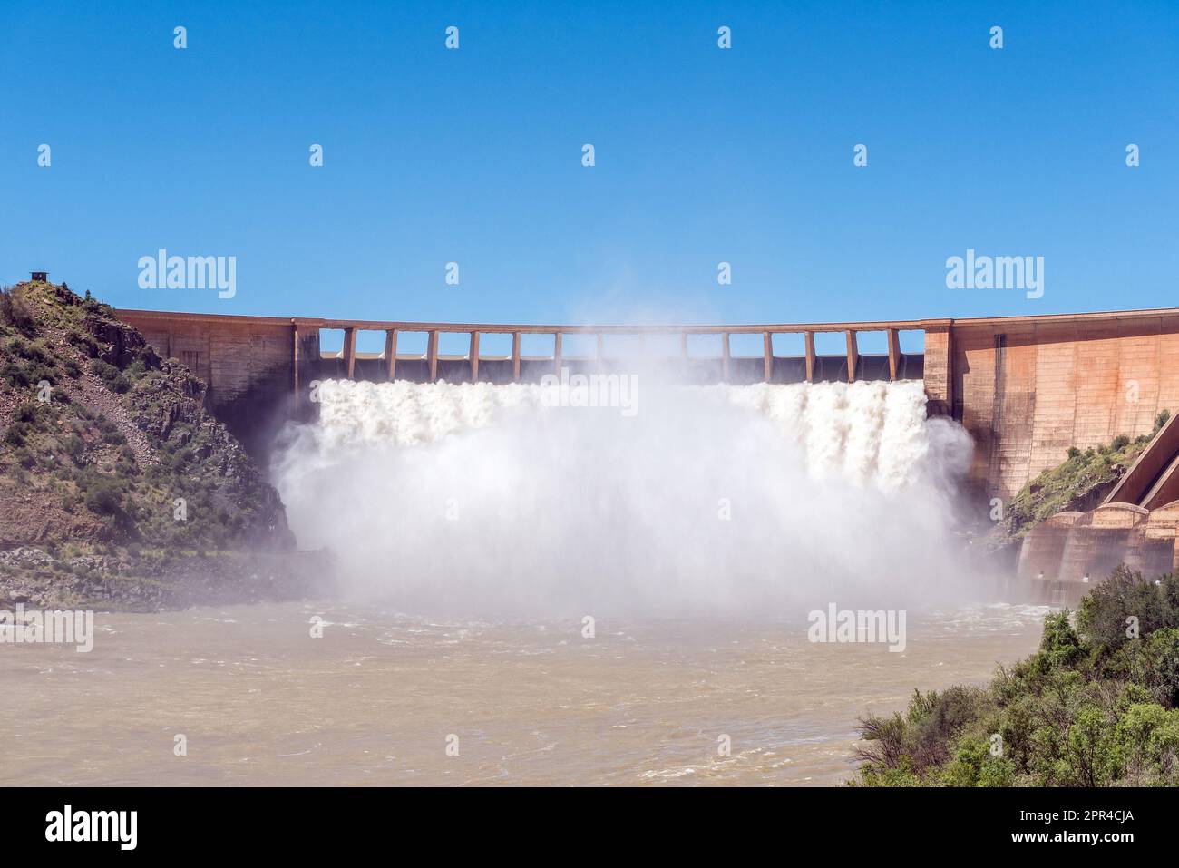 The Vanderkloof Dam overflowing seen from bridge below the dam wall. It ...