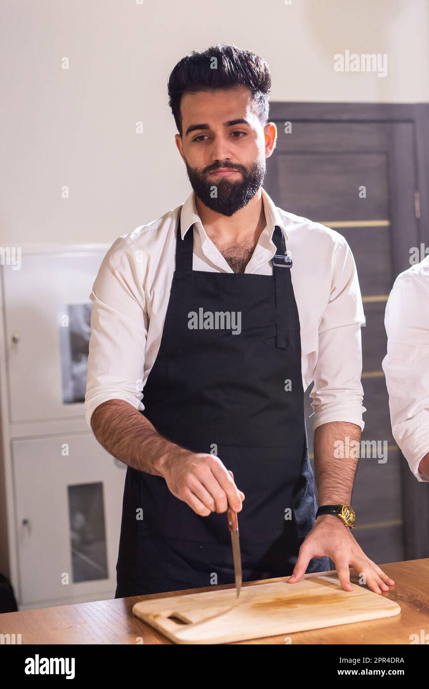 Portrait arabian male chef in restaurant kitchen Stock Photo - Alamy