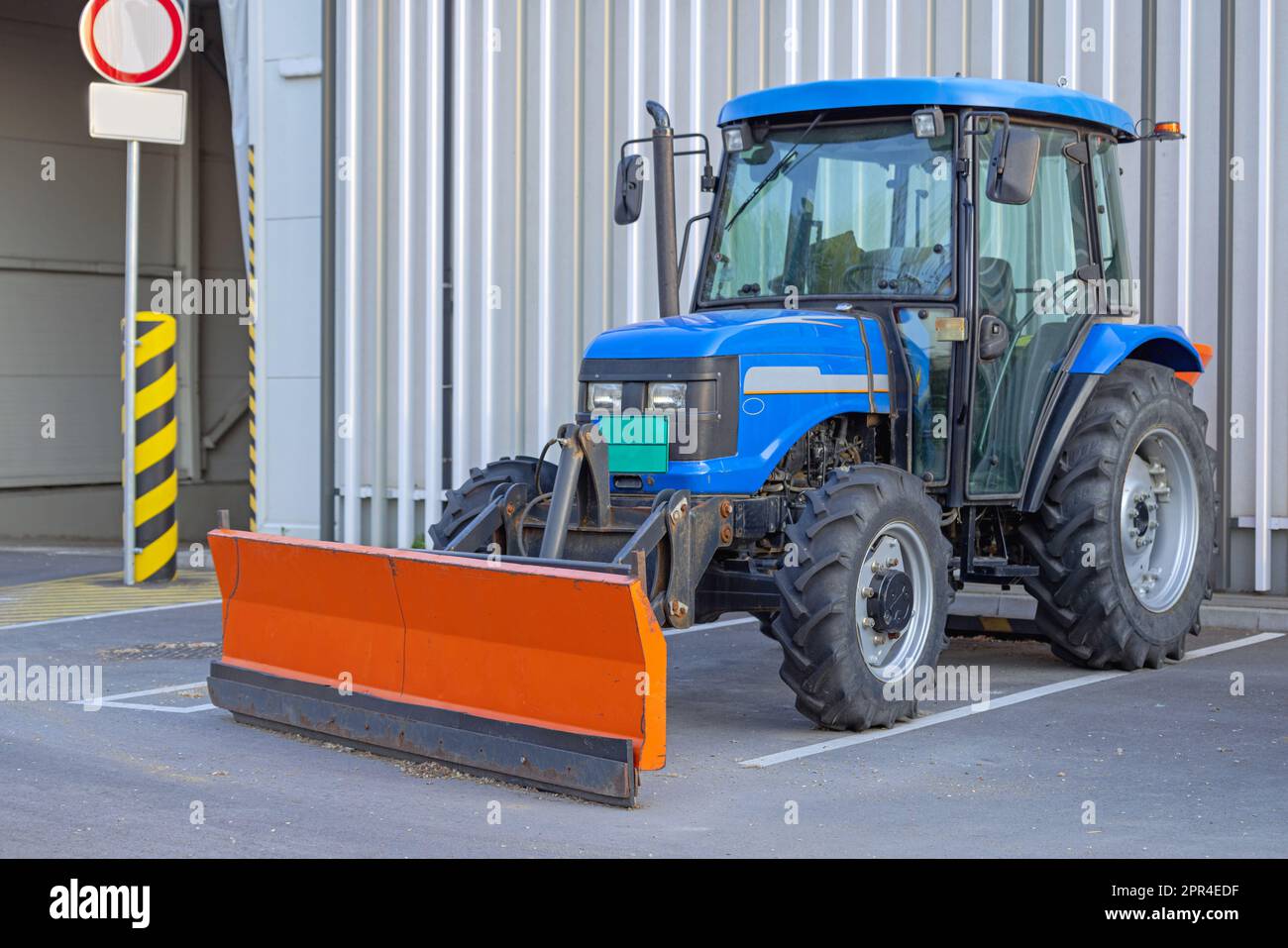 Tractor With Attached Flat Blade Snow Plow Scraper Pusher Parking Stock ...