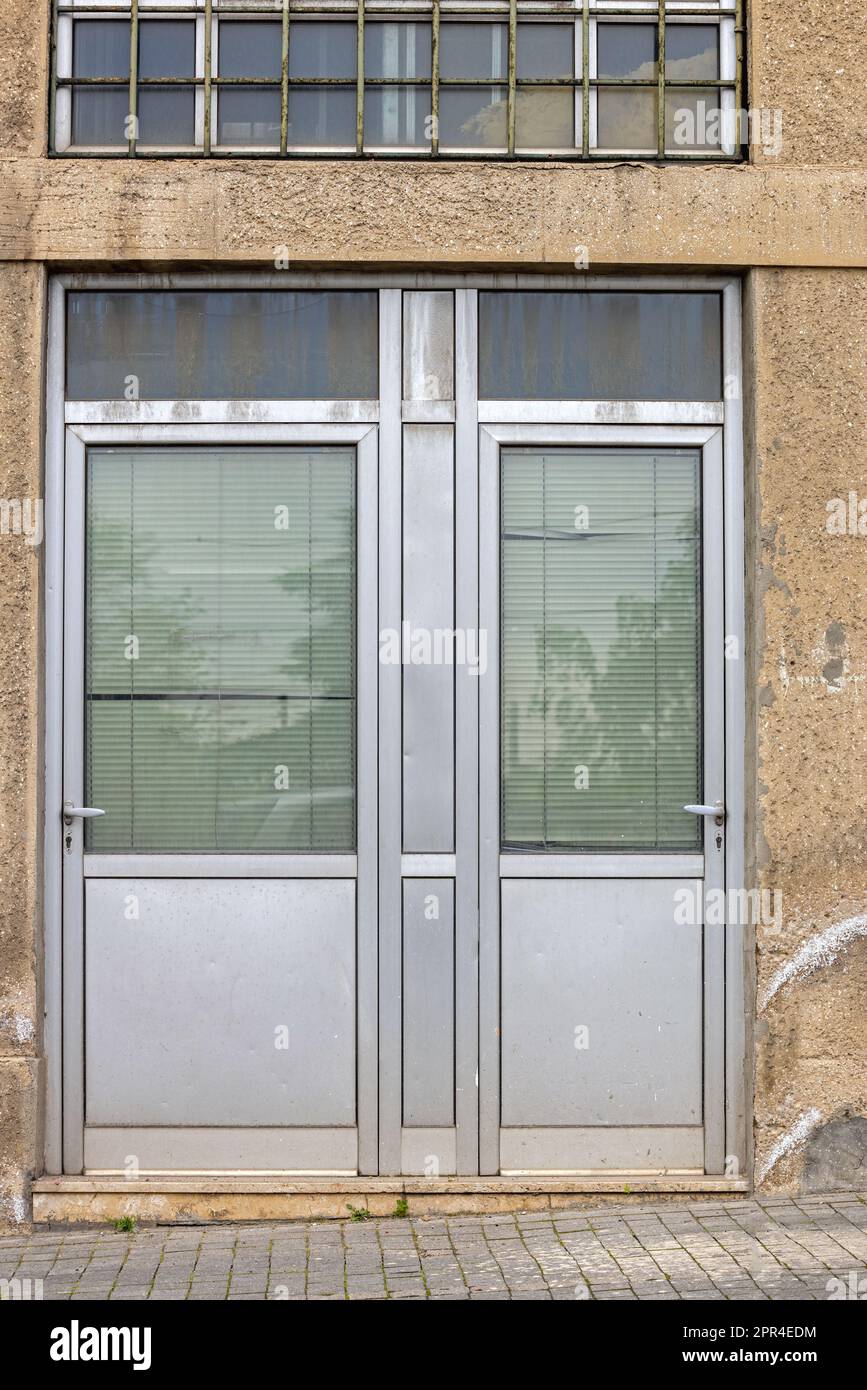 Double Aluminium Doors With Windows and Venetian Blinds Stock Photo - Alamy