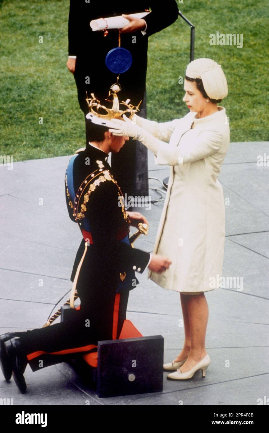 File photo dated 01/07/69 of Queen Elizabeth II investing her son ...