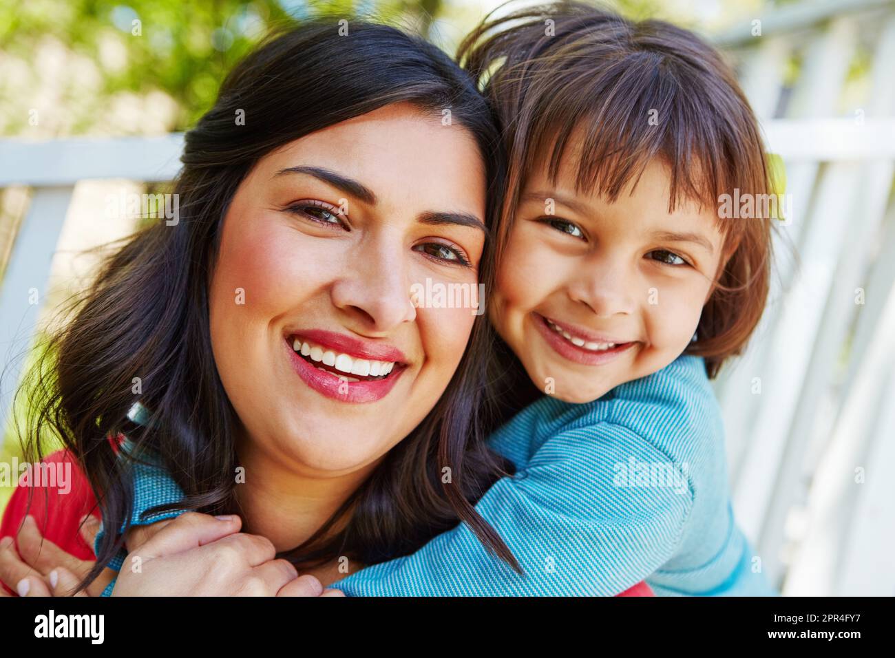 Shes been blessed with her mothers looks. a mother receiving a hug from ...
