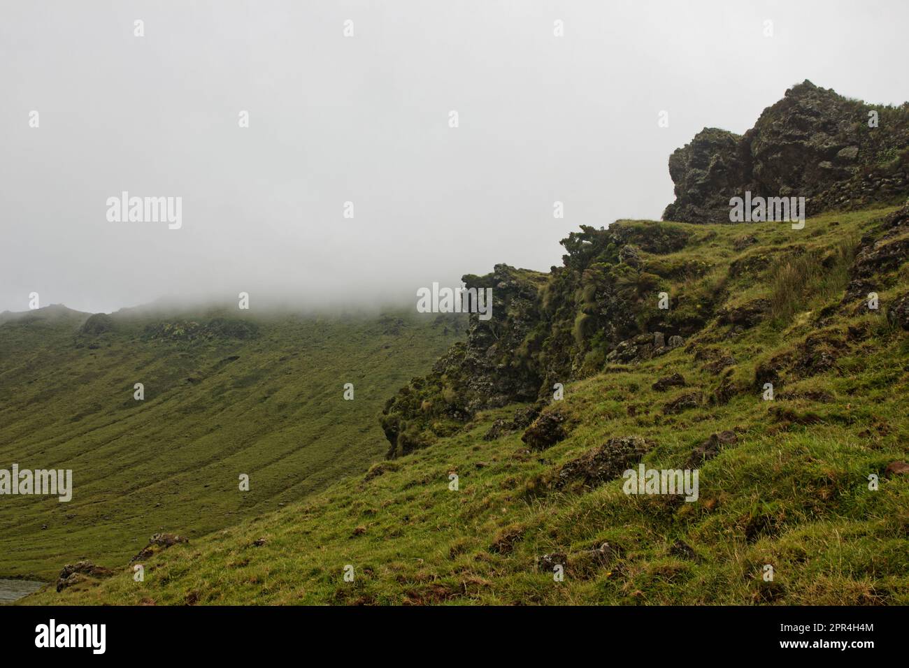 A foggy morning inside Caldeirão, the volcanic caldera of Corvo island ...