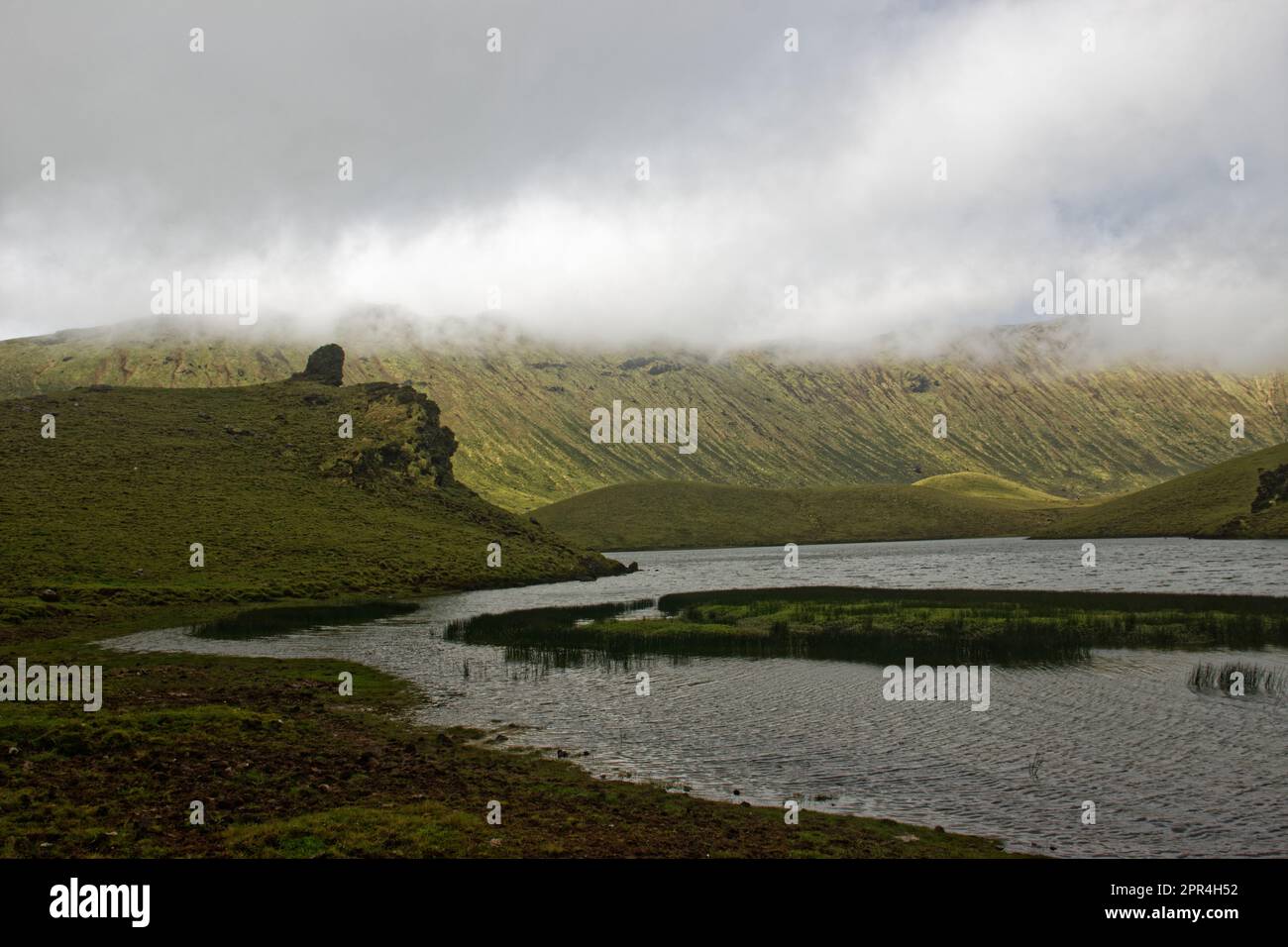 A panoramic view inside Caldeirão, the volcanic caldera of Corvo island ...