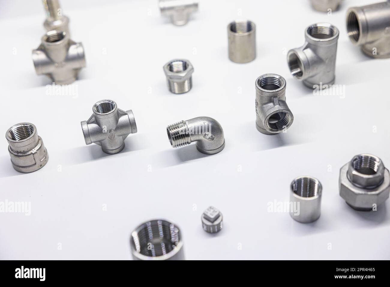 Metal Pipe Fittings or Pipe Connectors Piping and plumbing on white ...