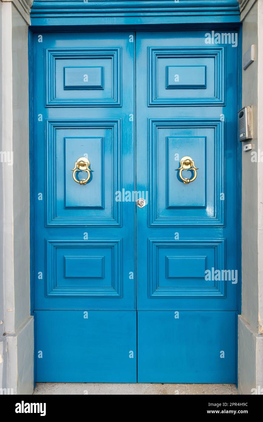 This stock photo features a stunning blue double door entrance to a ...