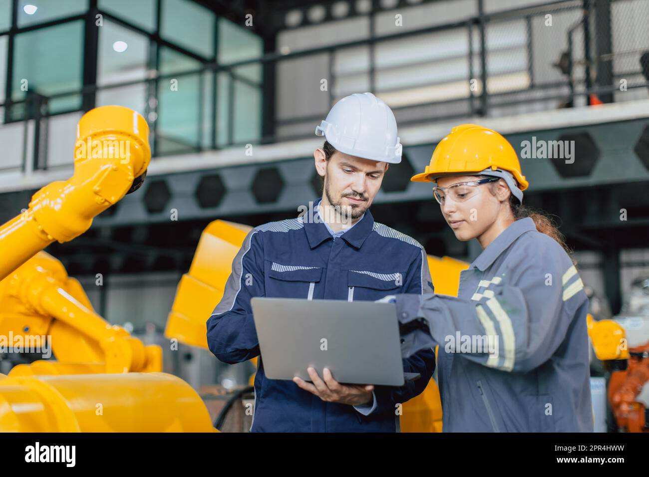 engineer team working together inspection quality robot arm in robot ...