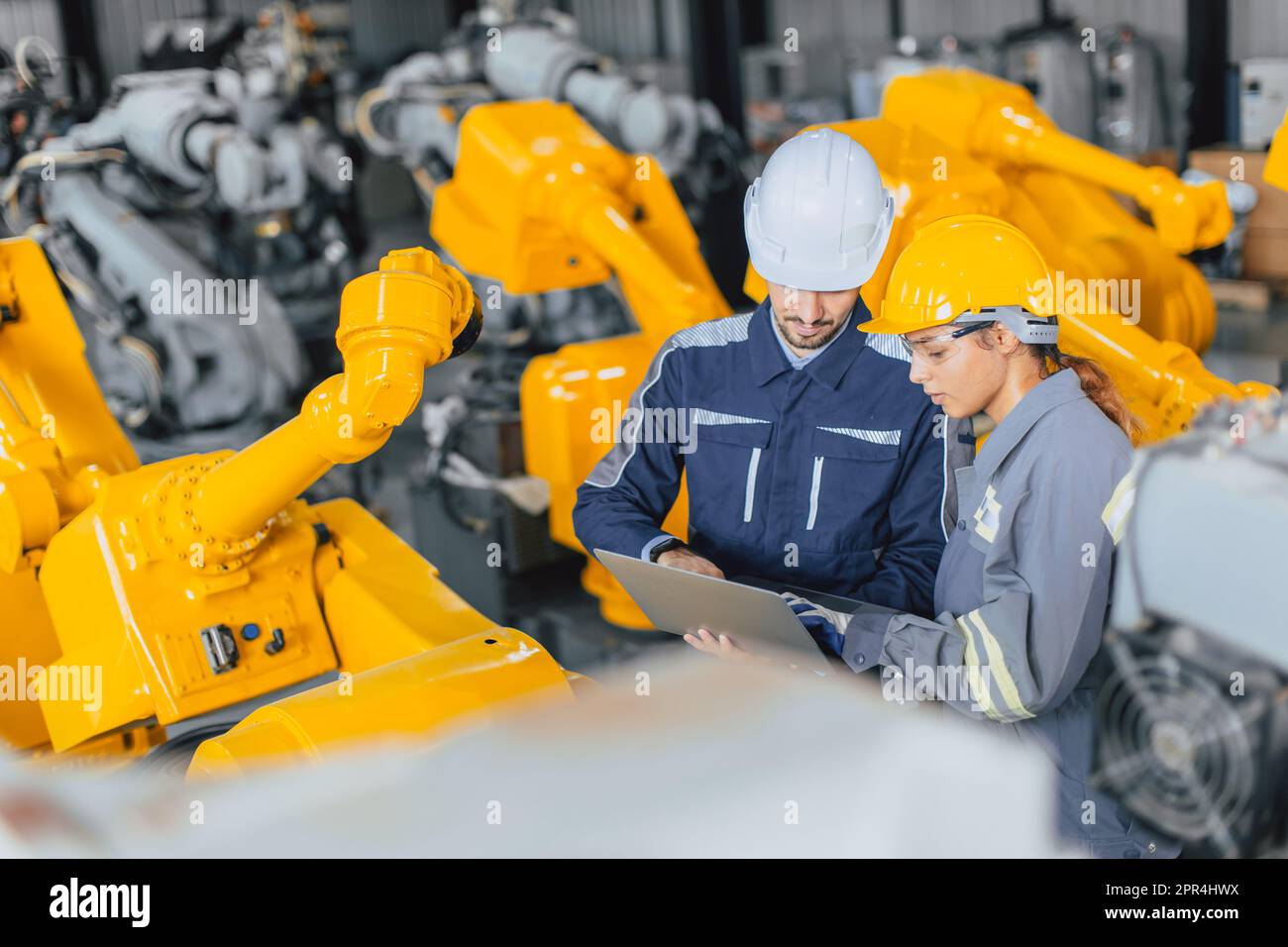 engineer team working together inspection quality robot arm in robot ...
