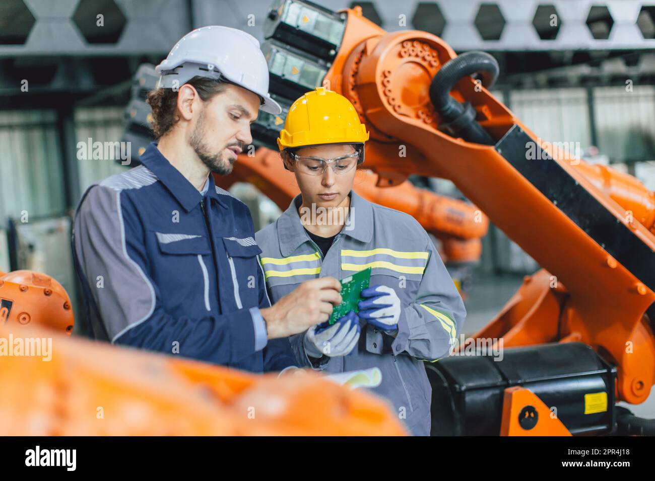 engineer team working together inspection quality robot arm in robot ...